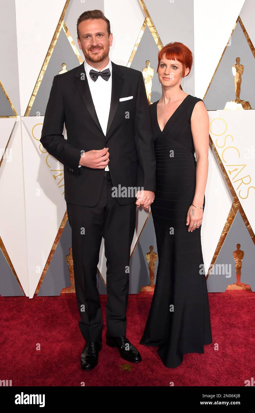 Jason Segel, left, and Alexis Minter arrive at the Oscars on Sunday ...