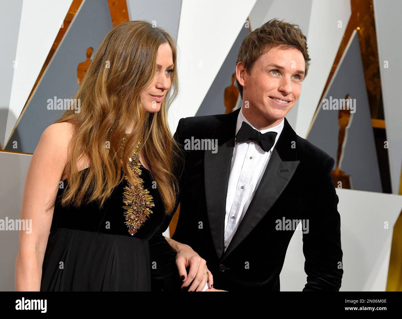 Hannah Redmayne, left, and Eddie Redmayne arrive at the Oscars on ...