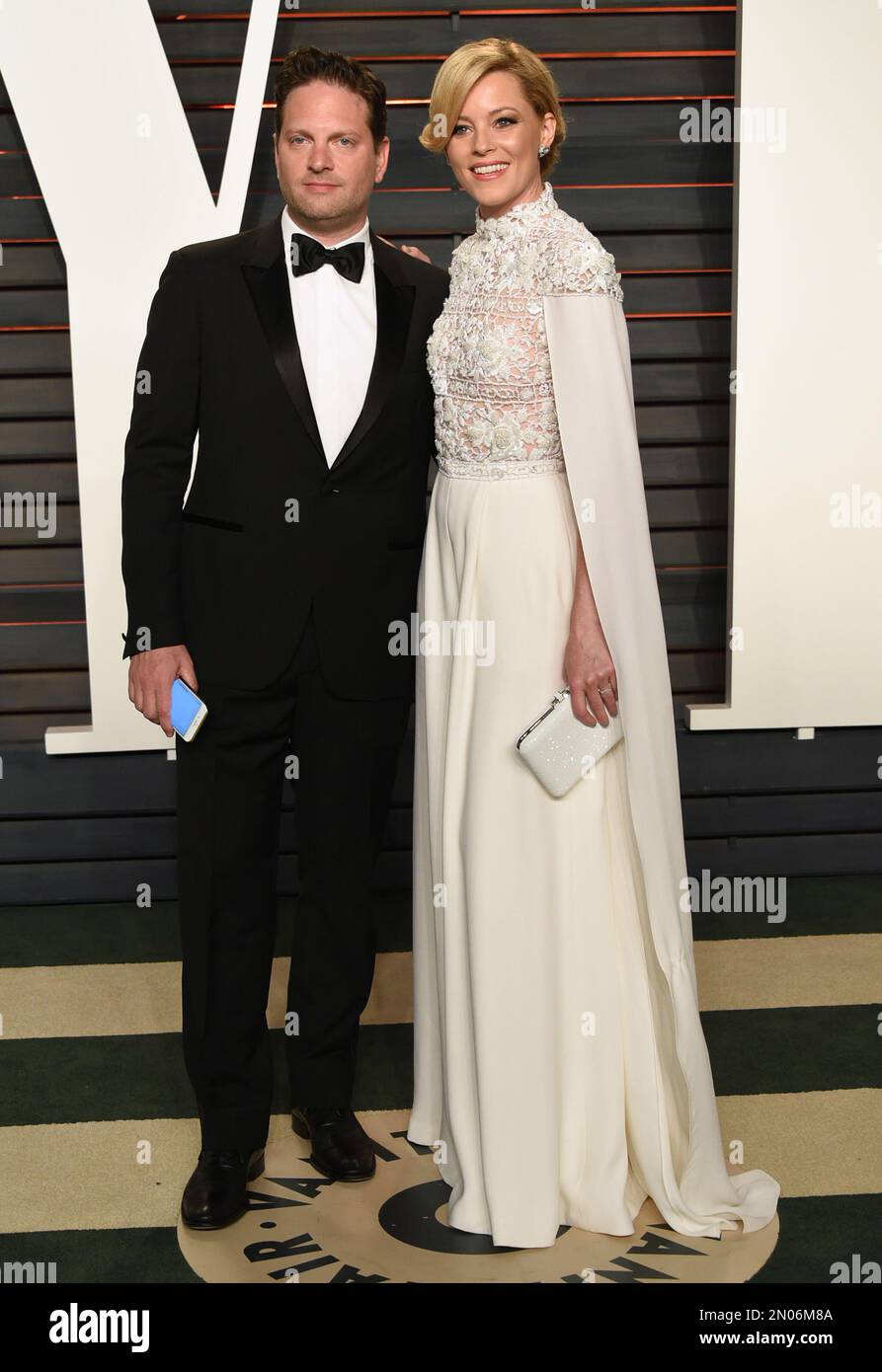 Max Handelman, left, and Elizabeth Banks arrive at the Vanity Fair ...