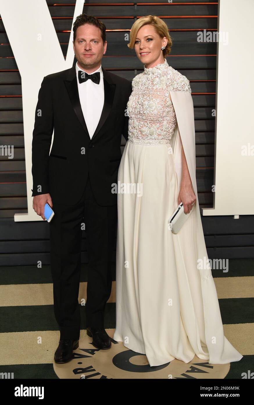 Max Handelman, left, and Elizabeth Banks arrive at the Vanity Fair ...