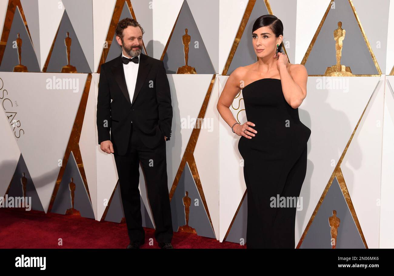 Michael Sheen, left, and Sarah Silverman arrive at the Oscars on Sunday ...