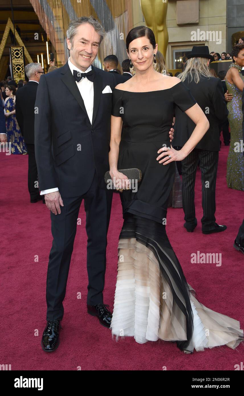 Carter Burwell, left, and Christine Sciulli arrive at the Oscars on ...