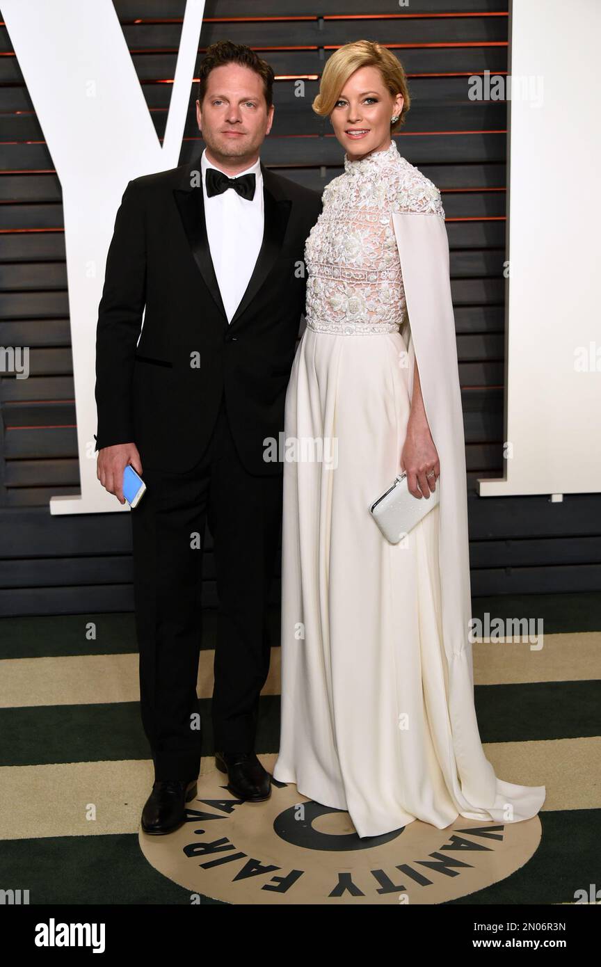 Max Handelman, left, and Elizabeth Banks arrive at the Vanity Fair ...