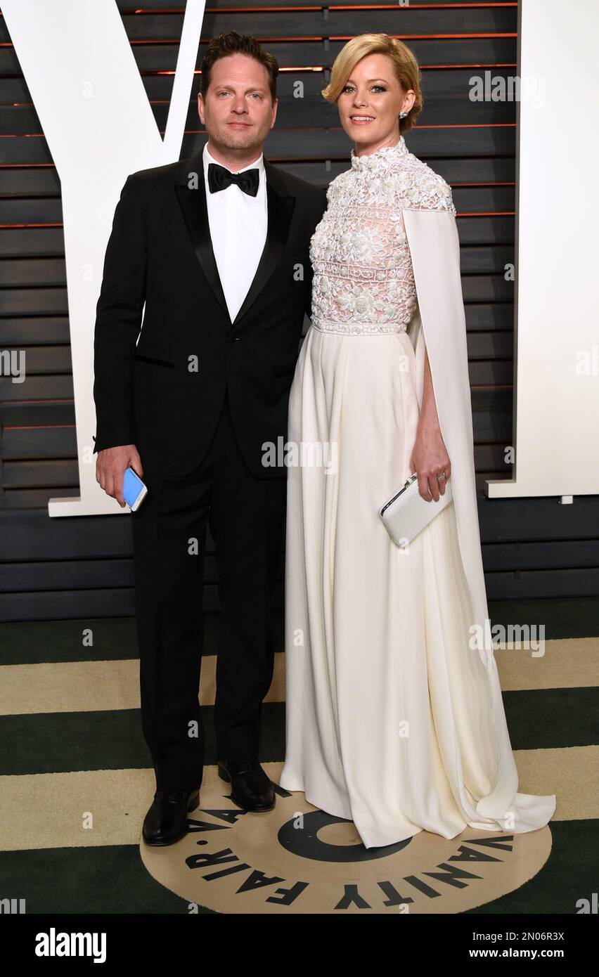 Max Handelman, left, and Elizabeth Banks arrive at the Vanity Fair ...