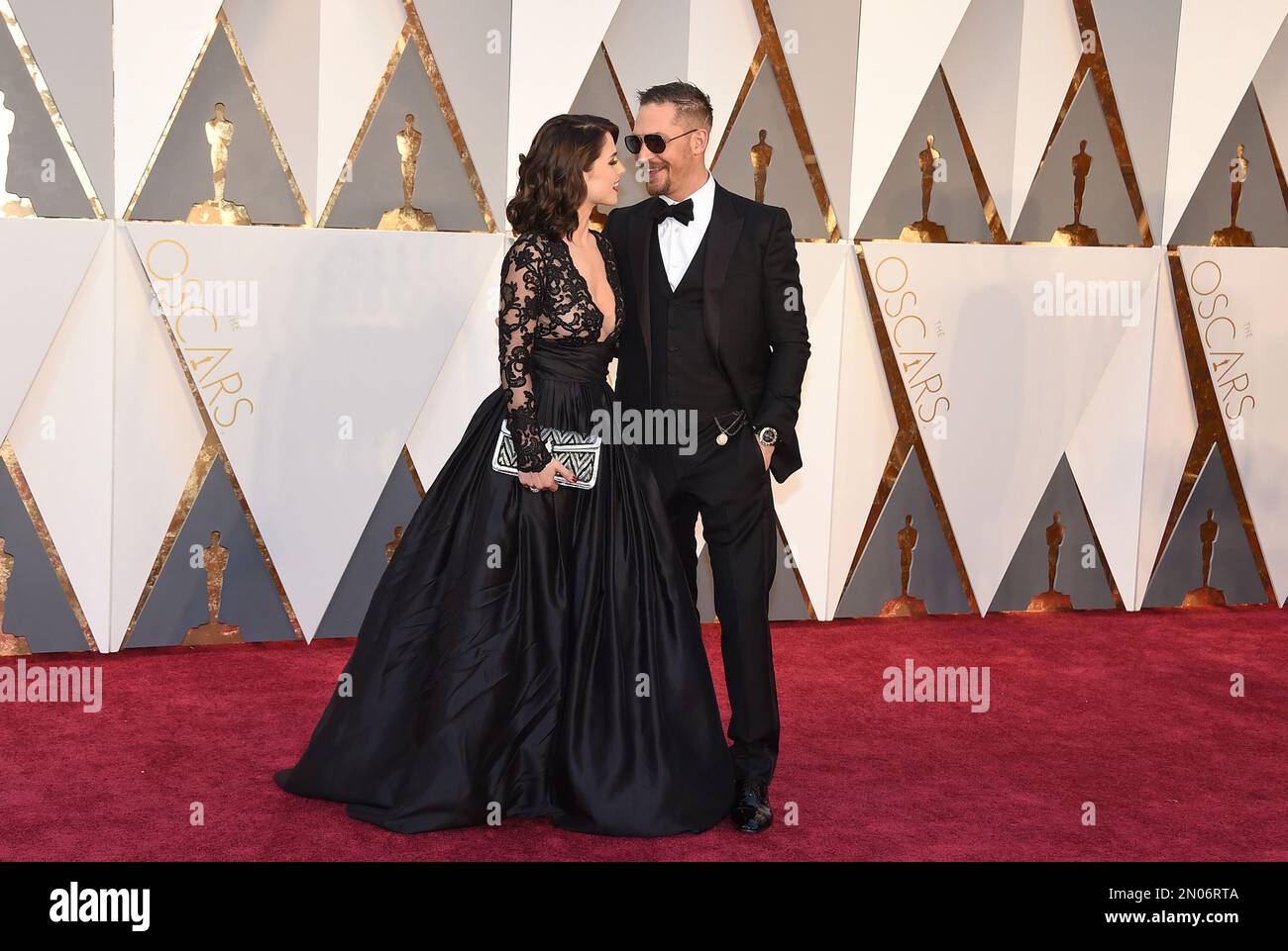 Charlotte Riley, left, and Tom Hardy arrive at the Oscars on Sunday ...