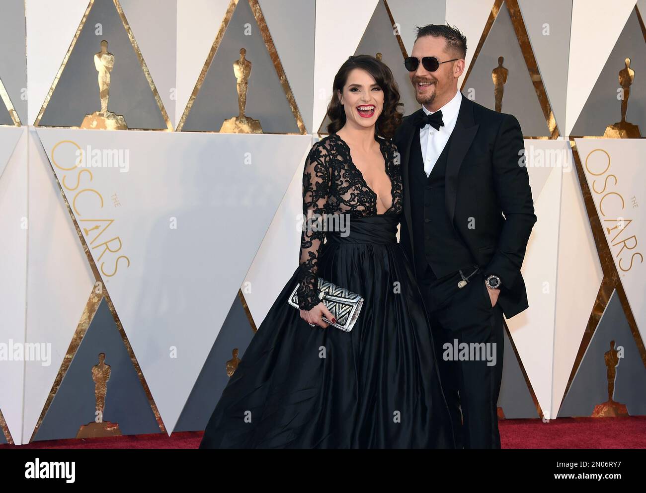 Charlotte Riley, left, and Tom Hardy arrive at the Oscars on Sunday ...