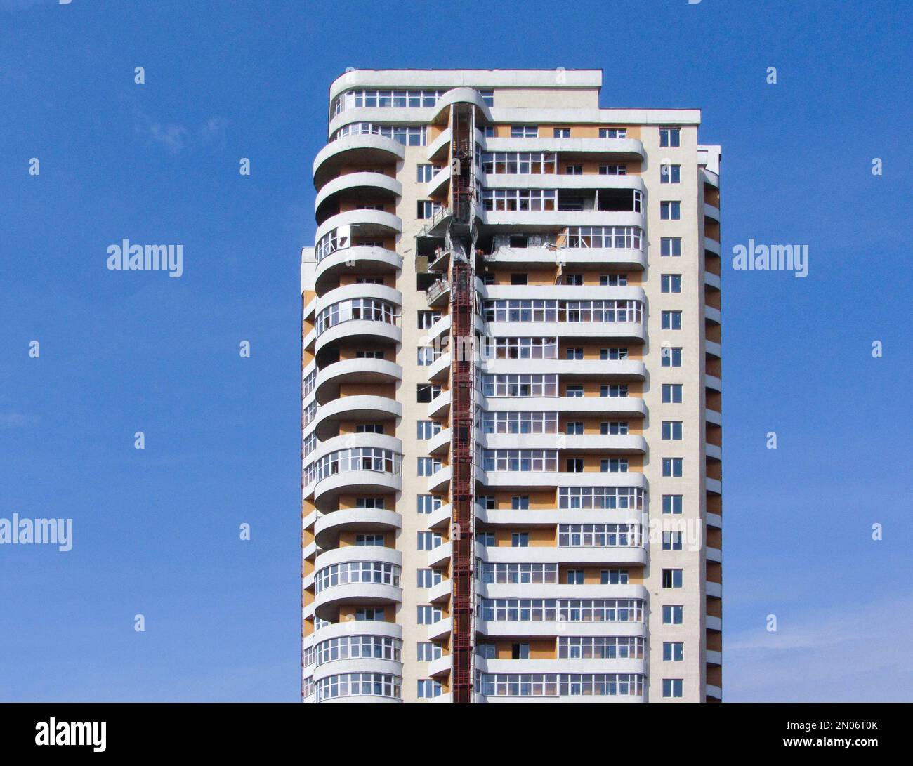 A tall building damaged by an explosion. A tall residential building ...