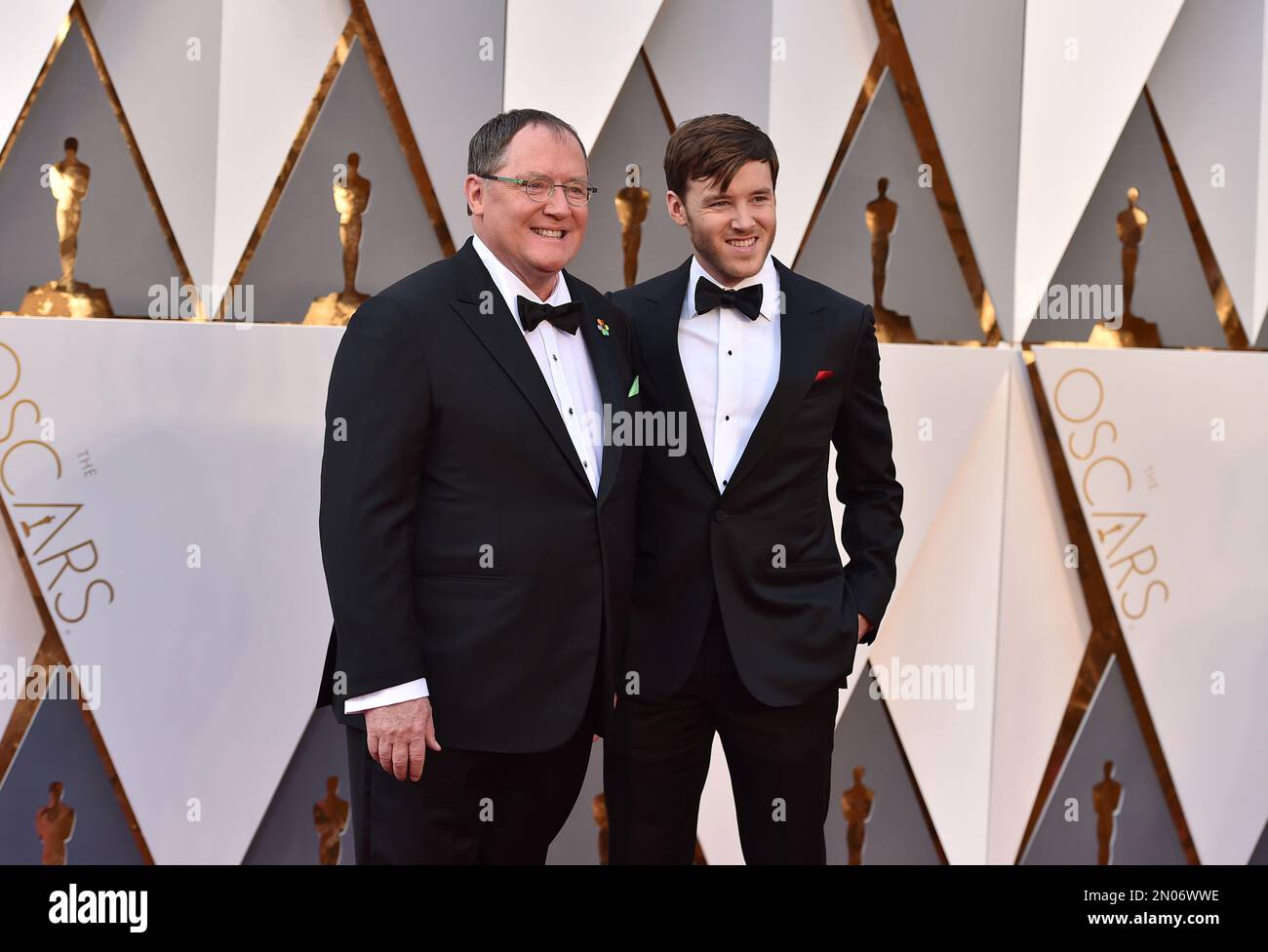 John Lasseter, left, and Paul James Lasseter arrive at the Oscars on ...