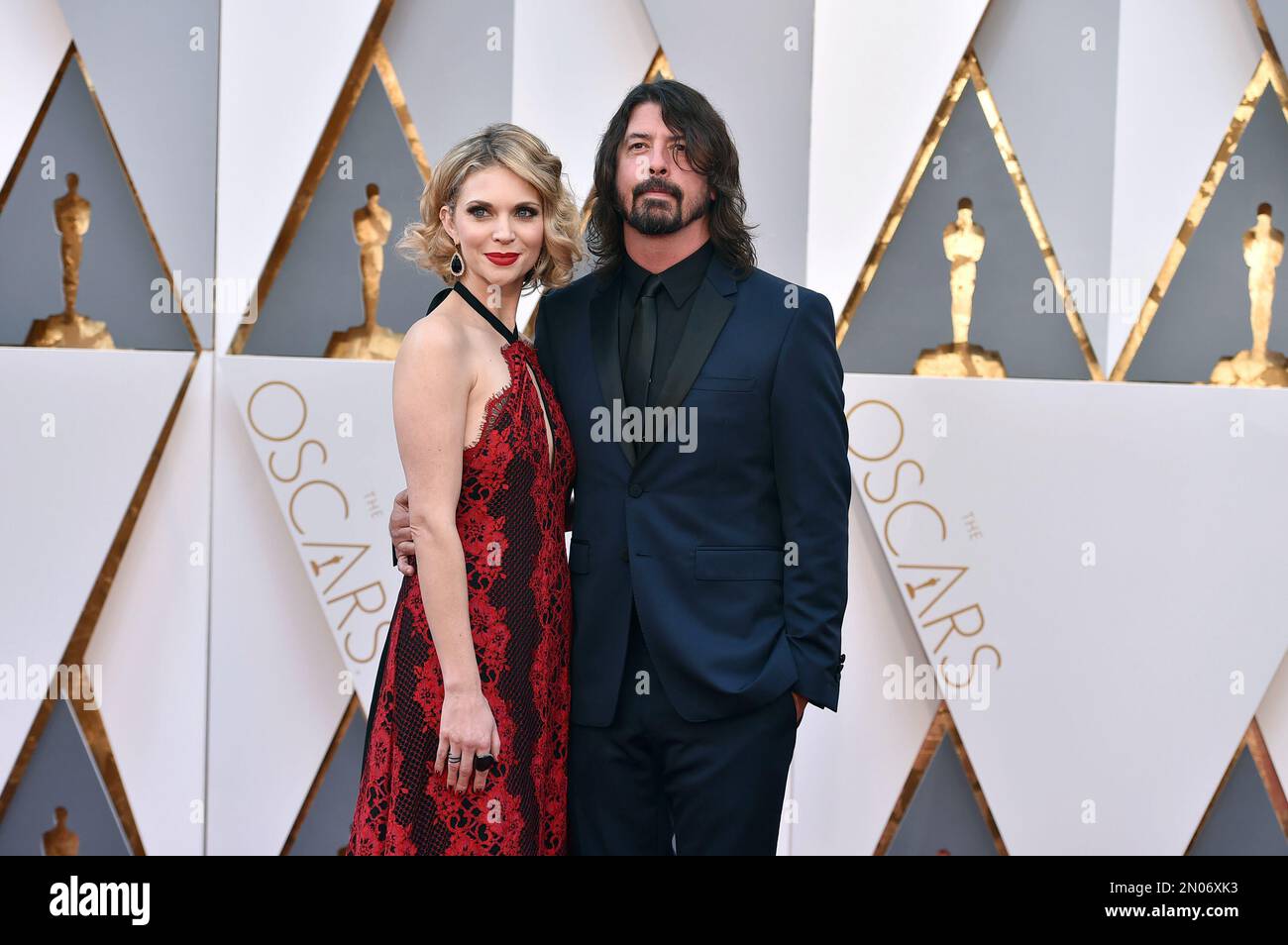 Jordyn Blum, left, and Dave Grohl arrive at the Oscars on Sunday, Feb ...