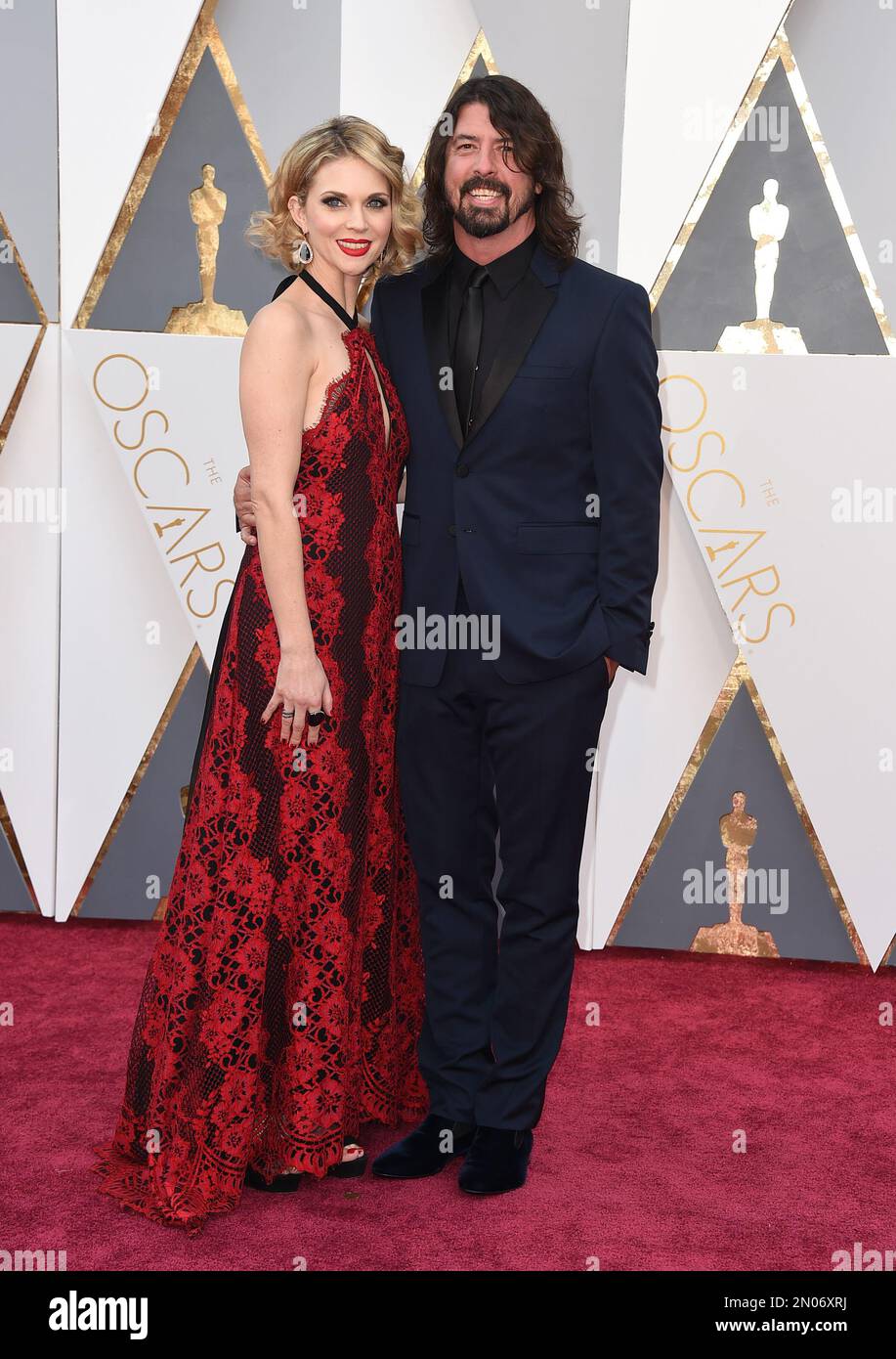 Jordyn Blum, left, and Dave Grohl arrive at the Oscars on Sunday, Feb ...