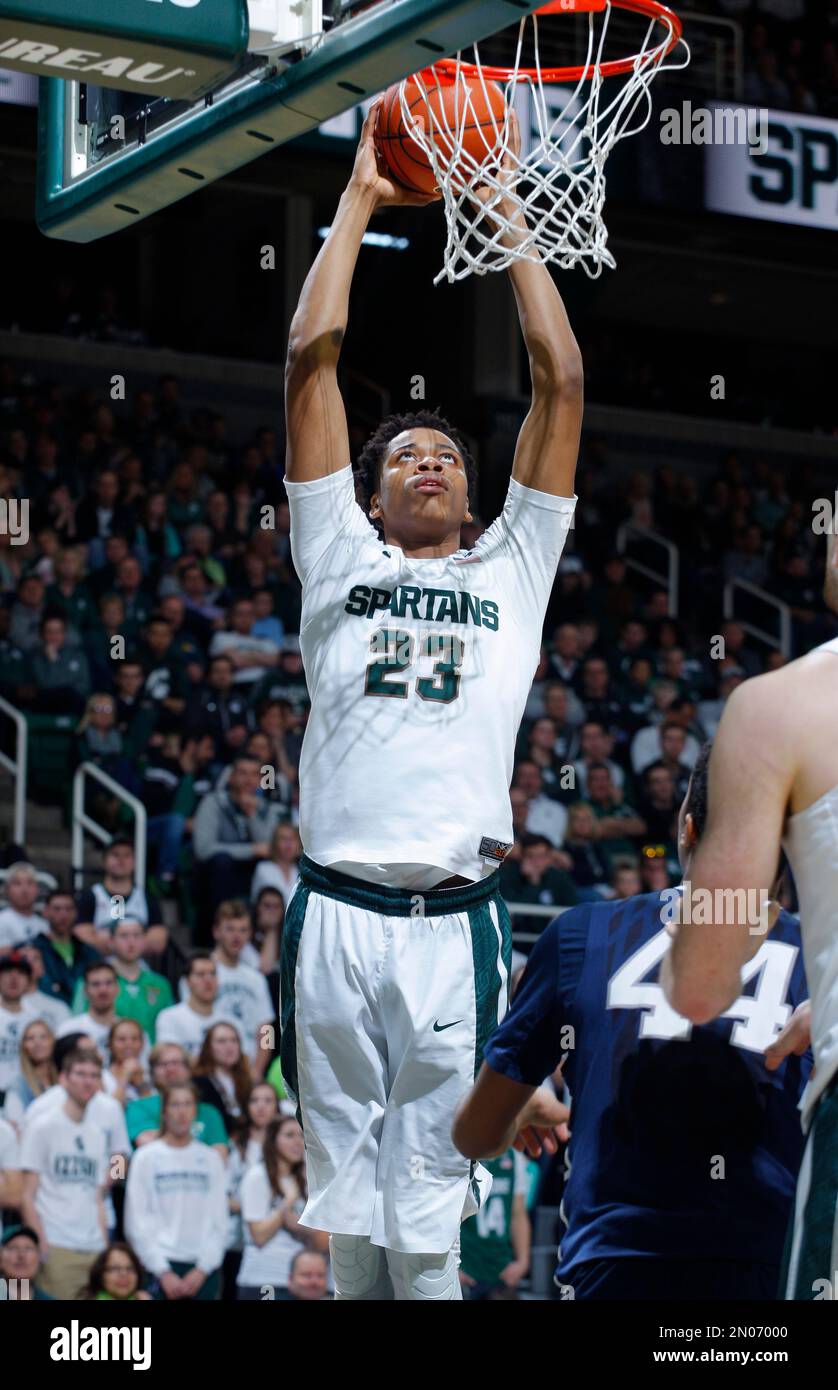 Michigan State's Deyonta Davis (23) goes up for a dunk against Penn ...
