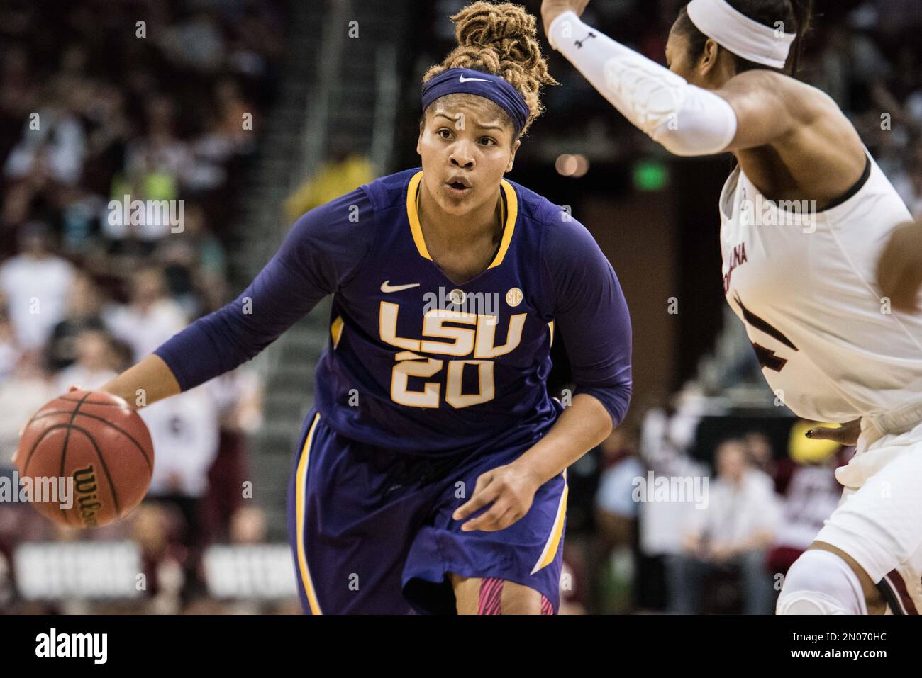 LSU forward Alexis Hyder (20) dribbles around South Carolina center ...
