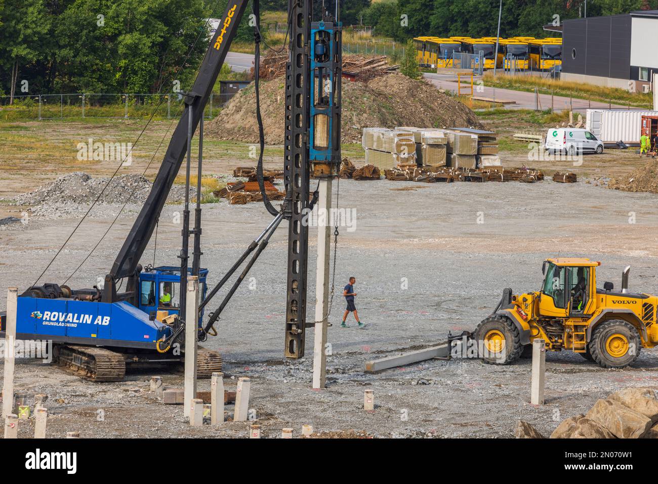 Industrial view on construction site. Pile driving machine driving ...