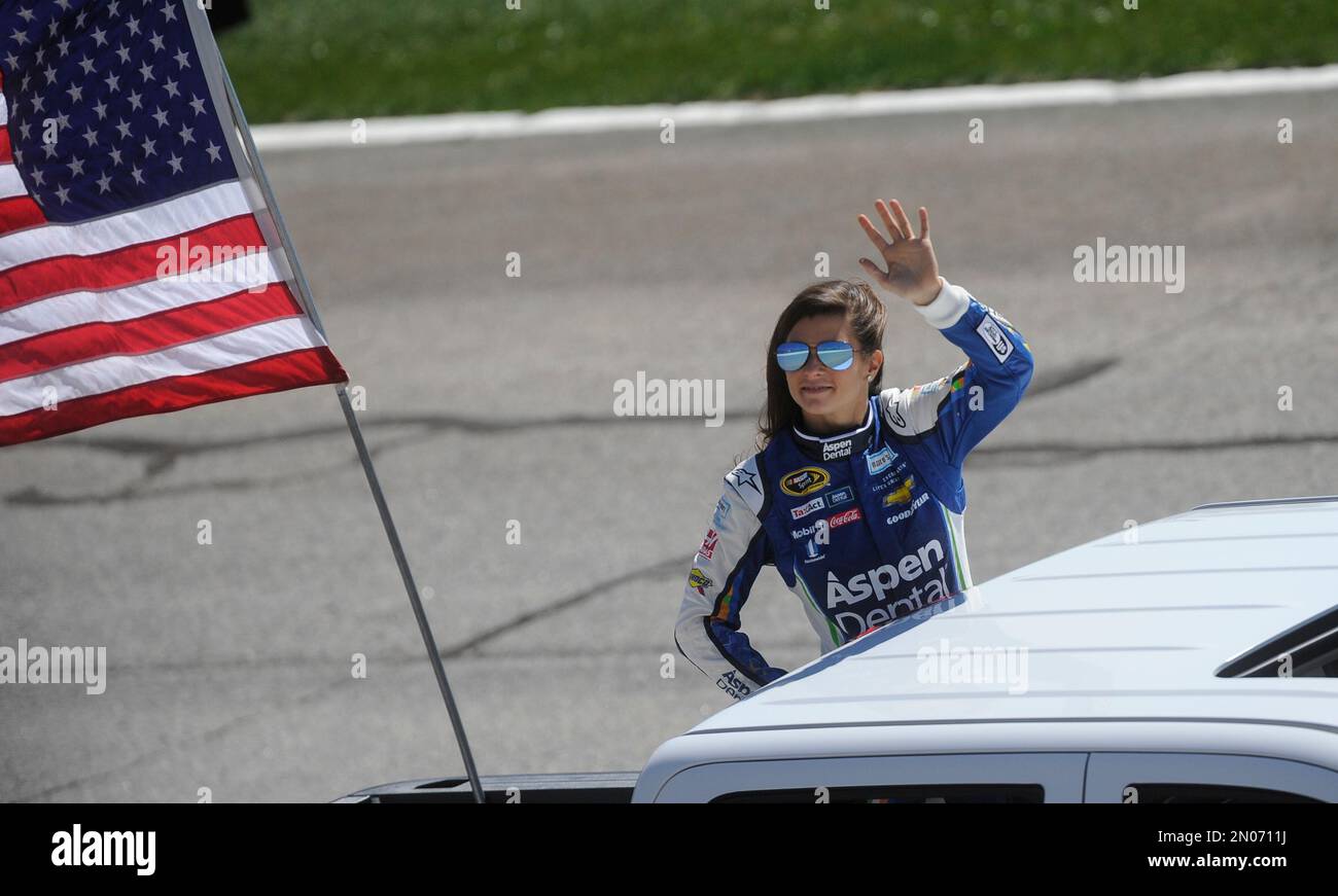 Danica Patrick waves to fans as she laps the track before the start of ...