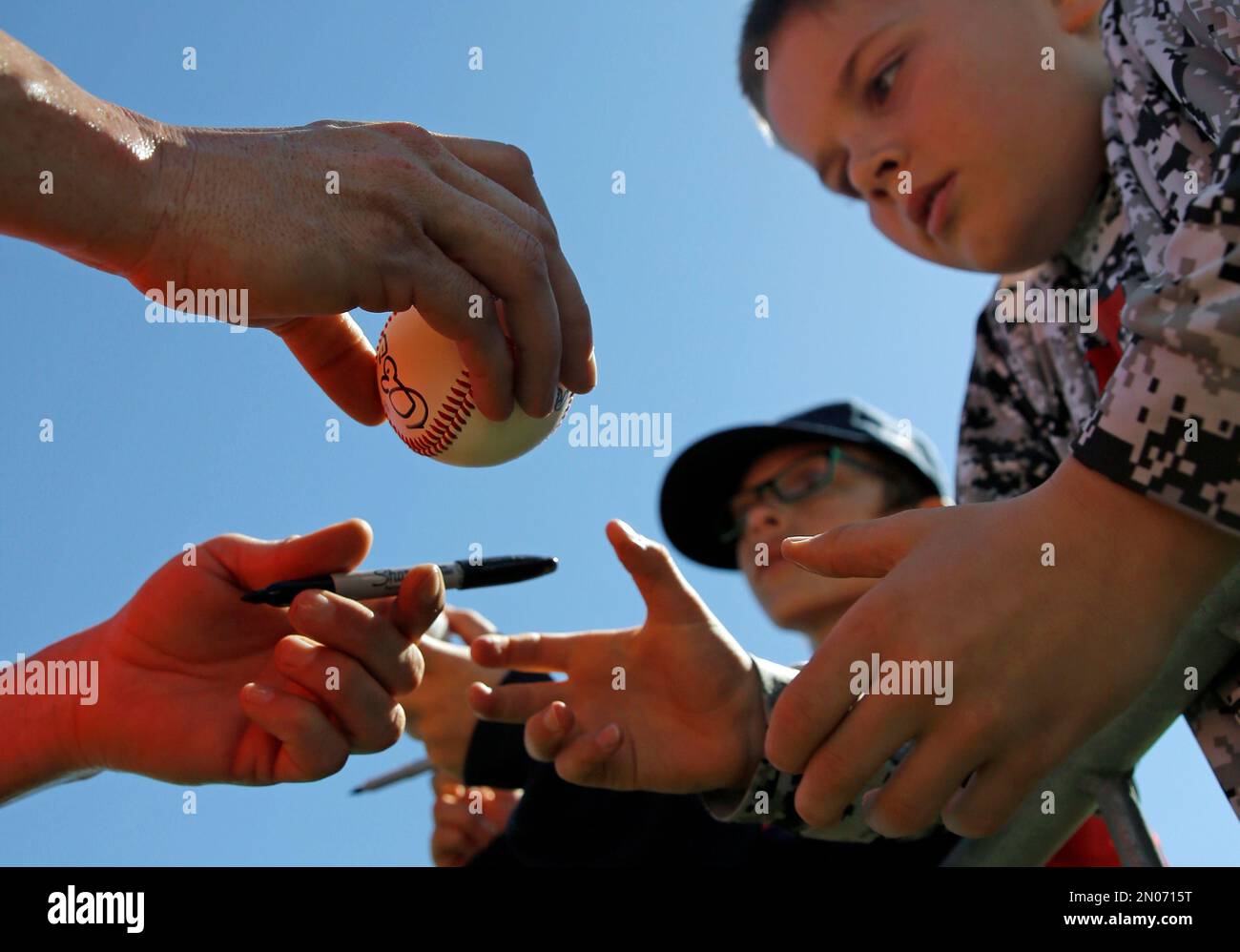 Boston Red Sox pitcher Tommy Layne hands a fan a baseball after ...