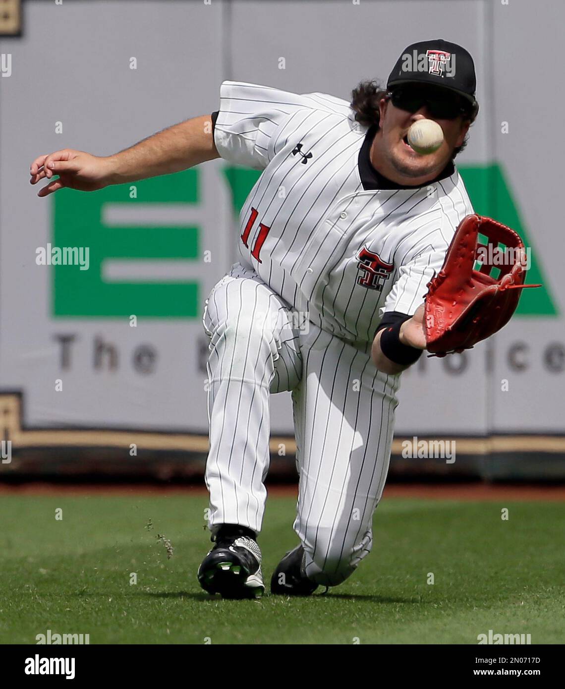Texas Tech right fielder Stephen Smith catches a fly ball hit by ...