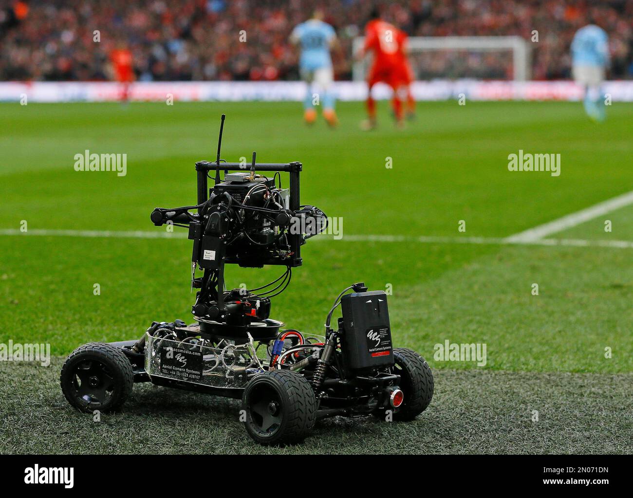 A wheeled remote camera films during the English League Cup final ...
