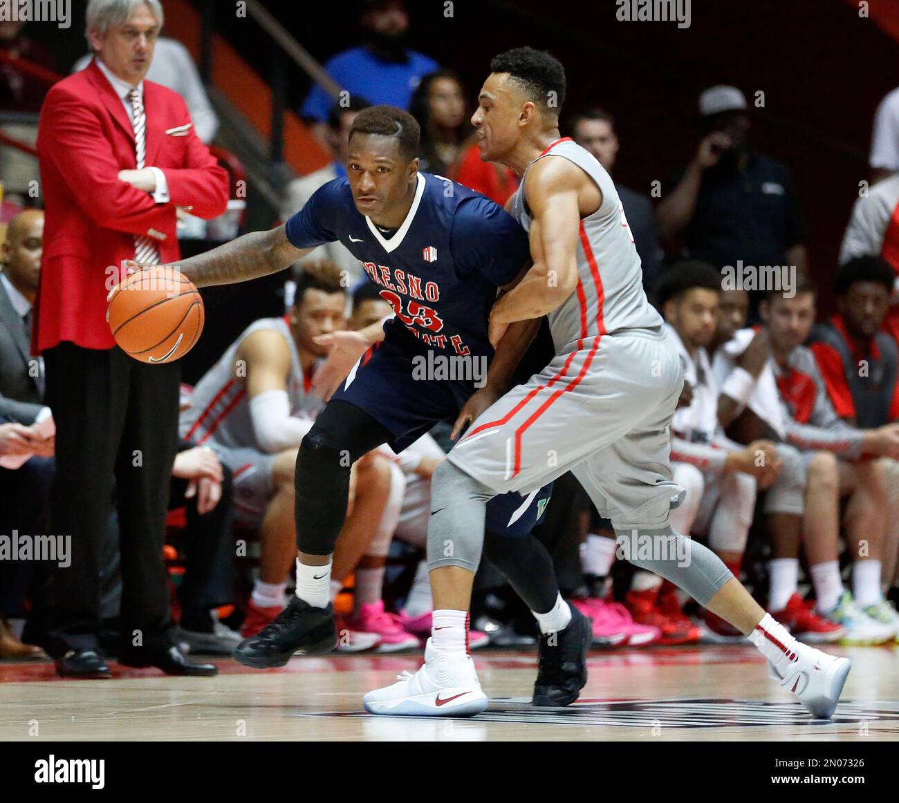 Fresno State's Marvelle Harris tries to dribble around New Mexico's ...