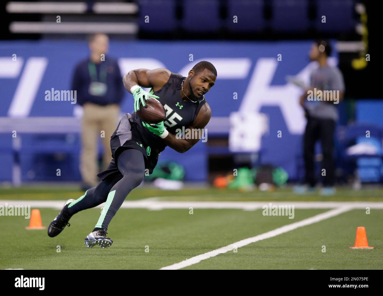Miami receiver Rashawn Scott runs a drill at the NFL football scouting ...