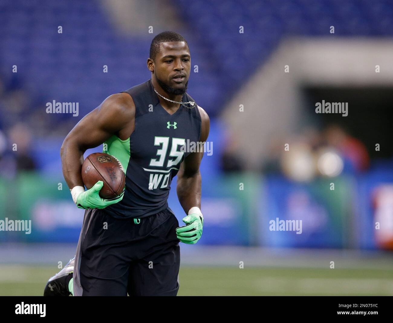 Miami receiver Rashawn Scott runs a drill at the NFL football scouting ...