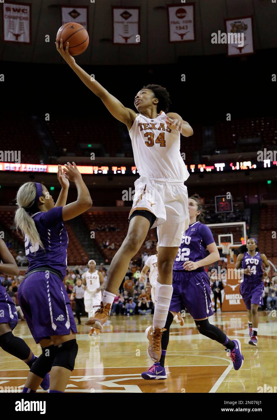 Texas center Imani Boyette (34) drives to the basket over TCU guard AJ ...