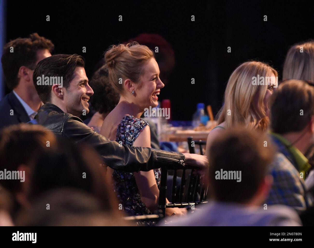 Alex Greenwald, left, and Brie Larson appear in the audience at the ...