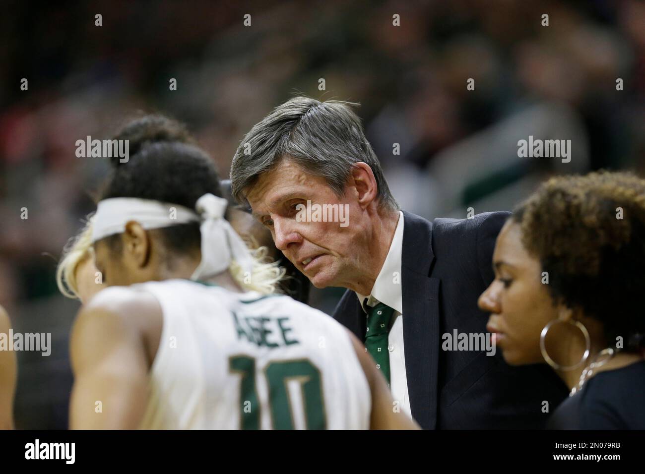 Michigan State assistant coach Mark Simons listens during a timeout ...