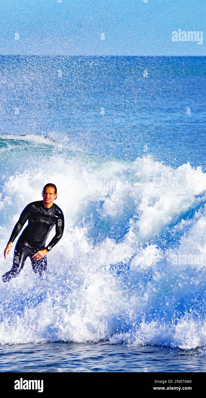 Surfing on beach sant hi-res stock photography and images - Alamy