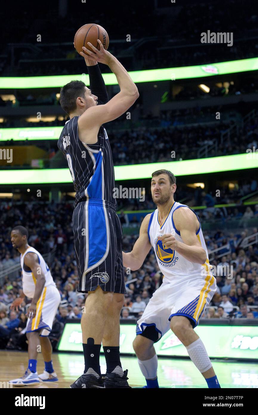 Orlando Magic center Nikola Vucevic (9) goes up for a shot in front of ...