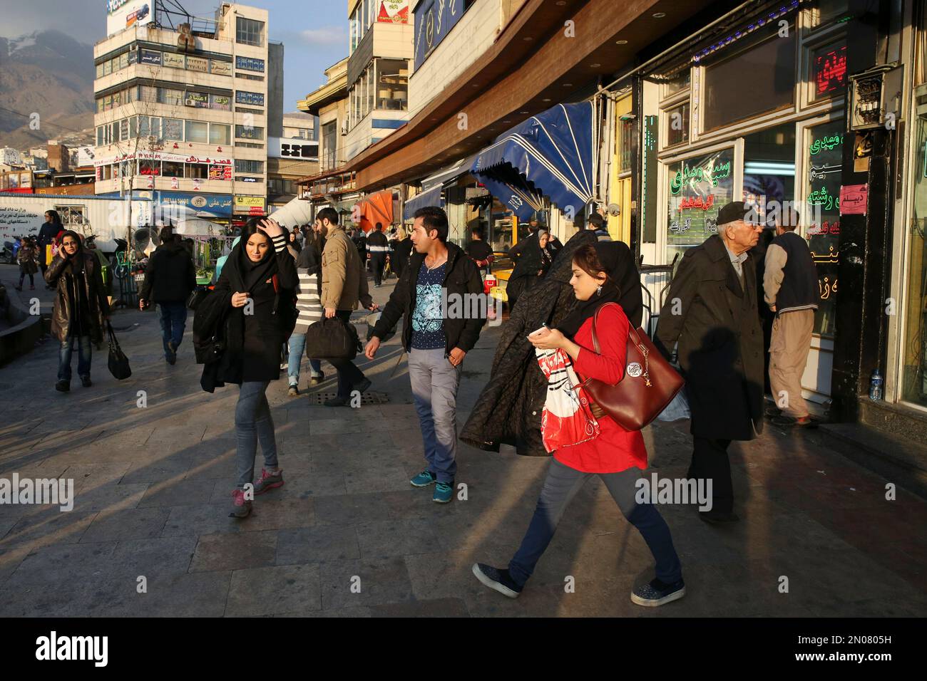 Iranians walk in Tajrish square in northern Tehran, Iran, Thursday, Feb ...