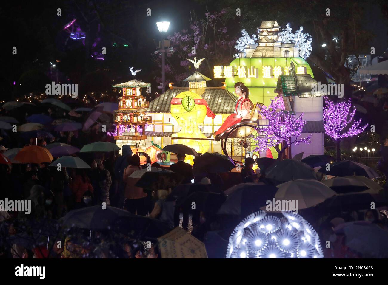 People look at lanterns for the Lantern Festival, marking the end of ...