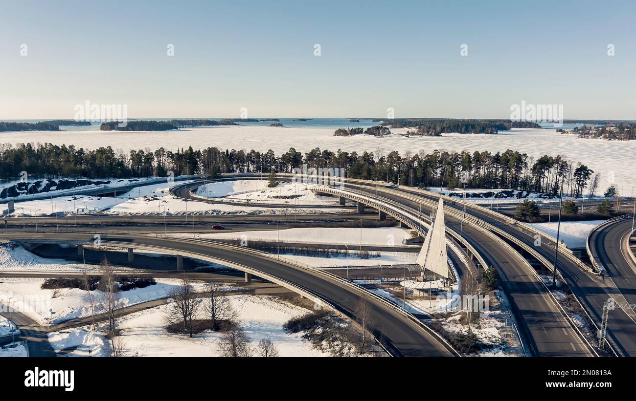 Aerial view of a freeway intersection Snow-covered in winter. Busy ...