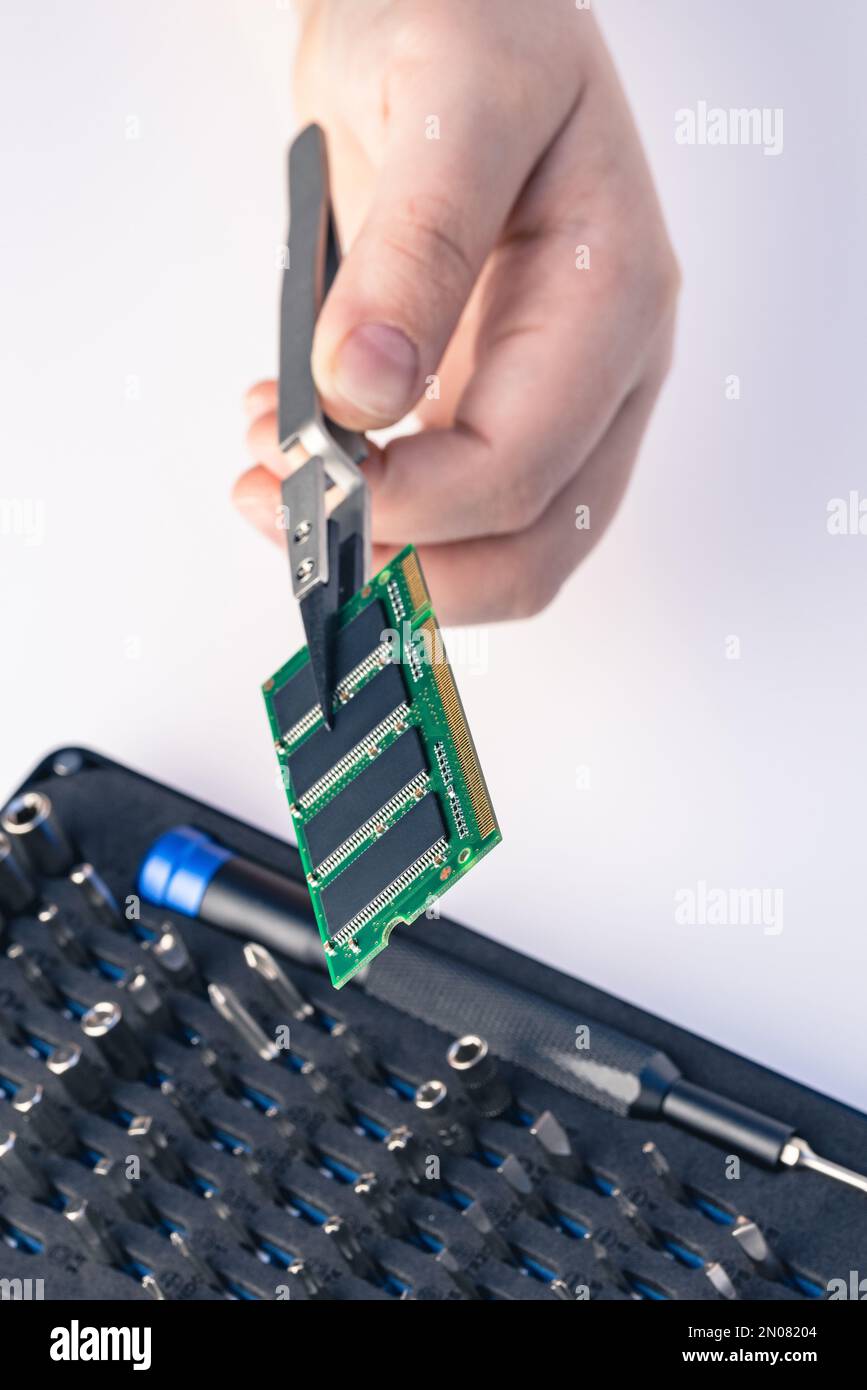Technician fixing computer. Repair and upgrade concept of laptop ...