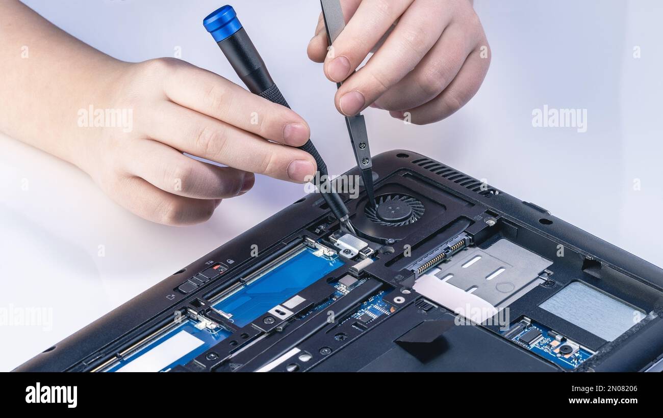 Technician fixing computer. Repair and upgrade concept of laptop ...