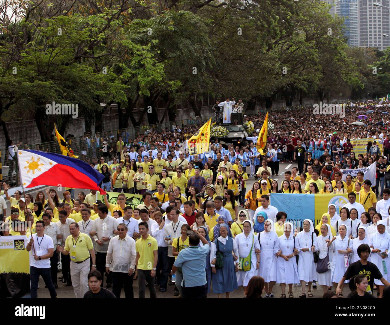 People link arms as they march at the 30th anniversary celebration of ...