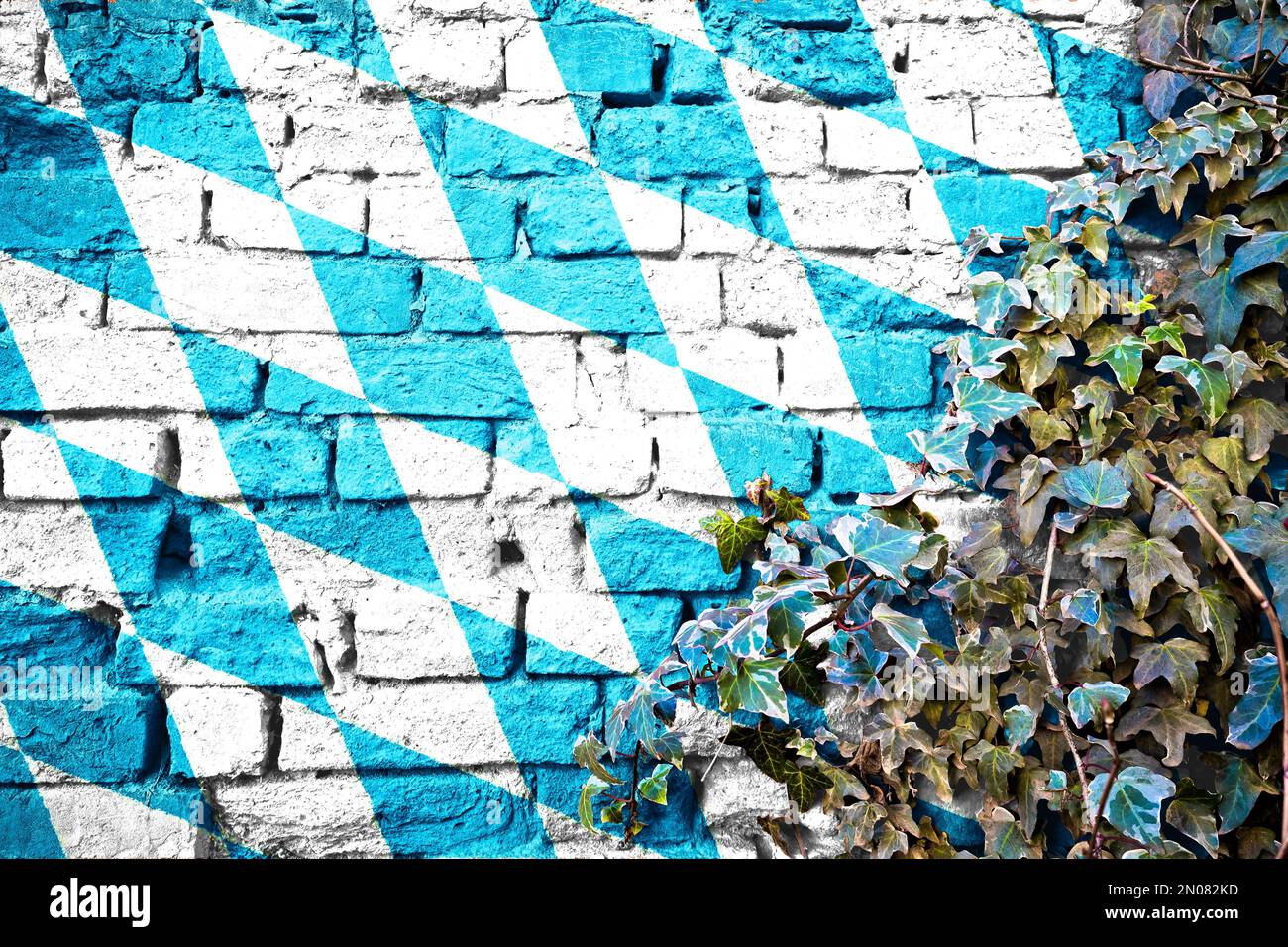 Bavaria grunge flag on brick wall with ivy plant, state symbol concept ...