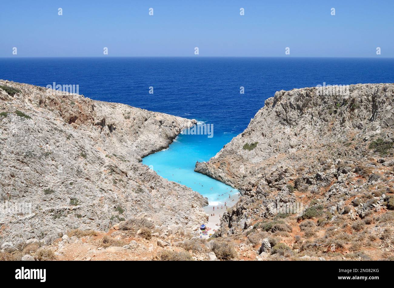 Little lagoon between the steep cliffs of the peninsula - Crete Island ...