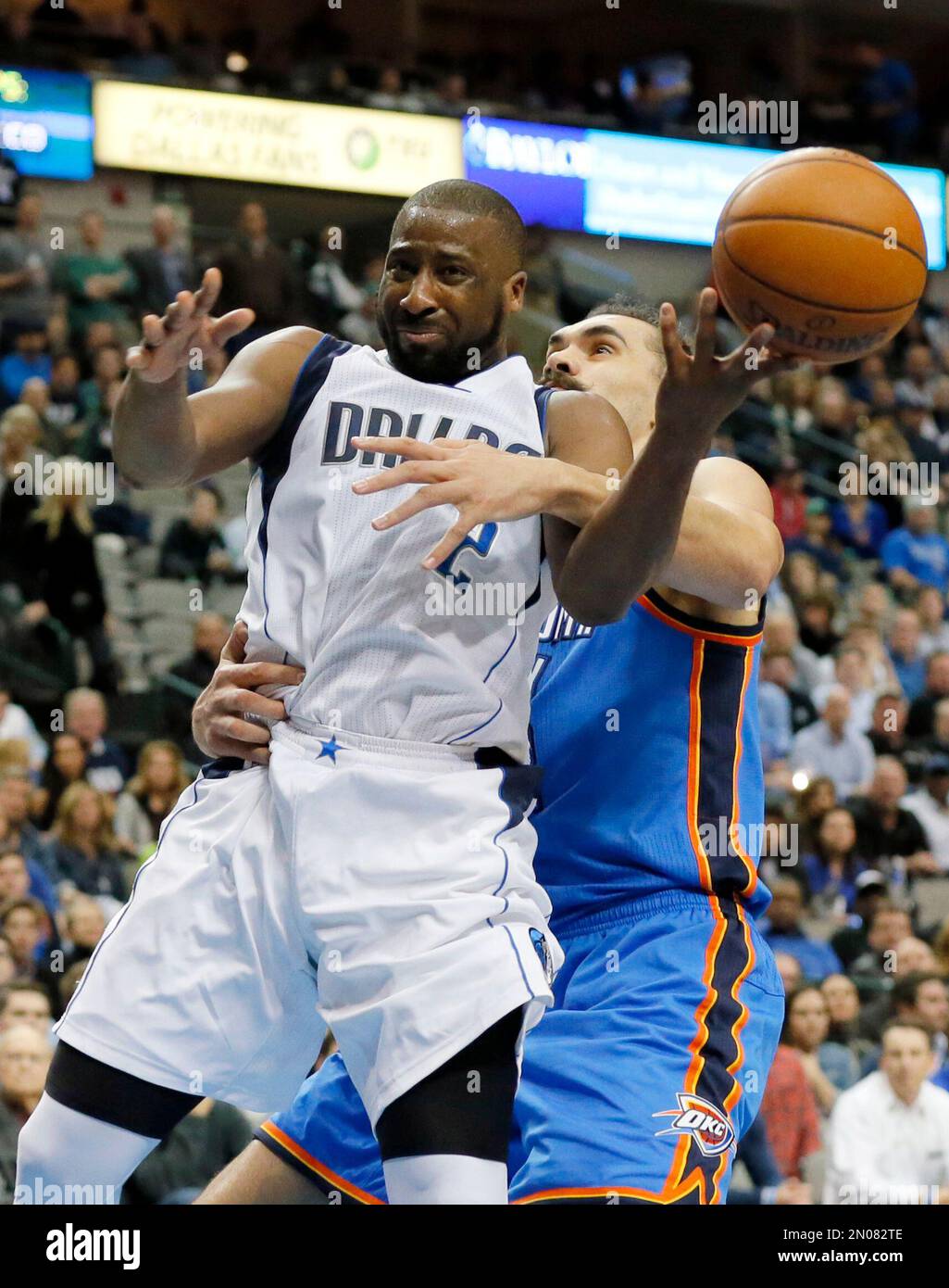 Dallas Mavericks' Raymond Felton (2) is fouled on a drive to the basket ...