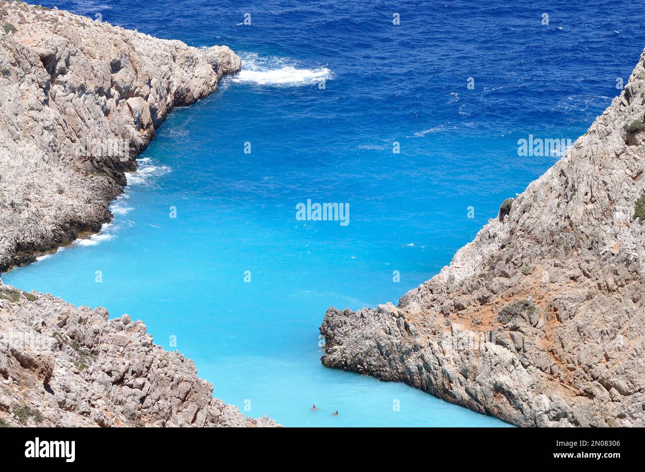 Little lagoon between the steep cliffs of the peninsula - Crete Island ...