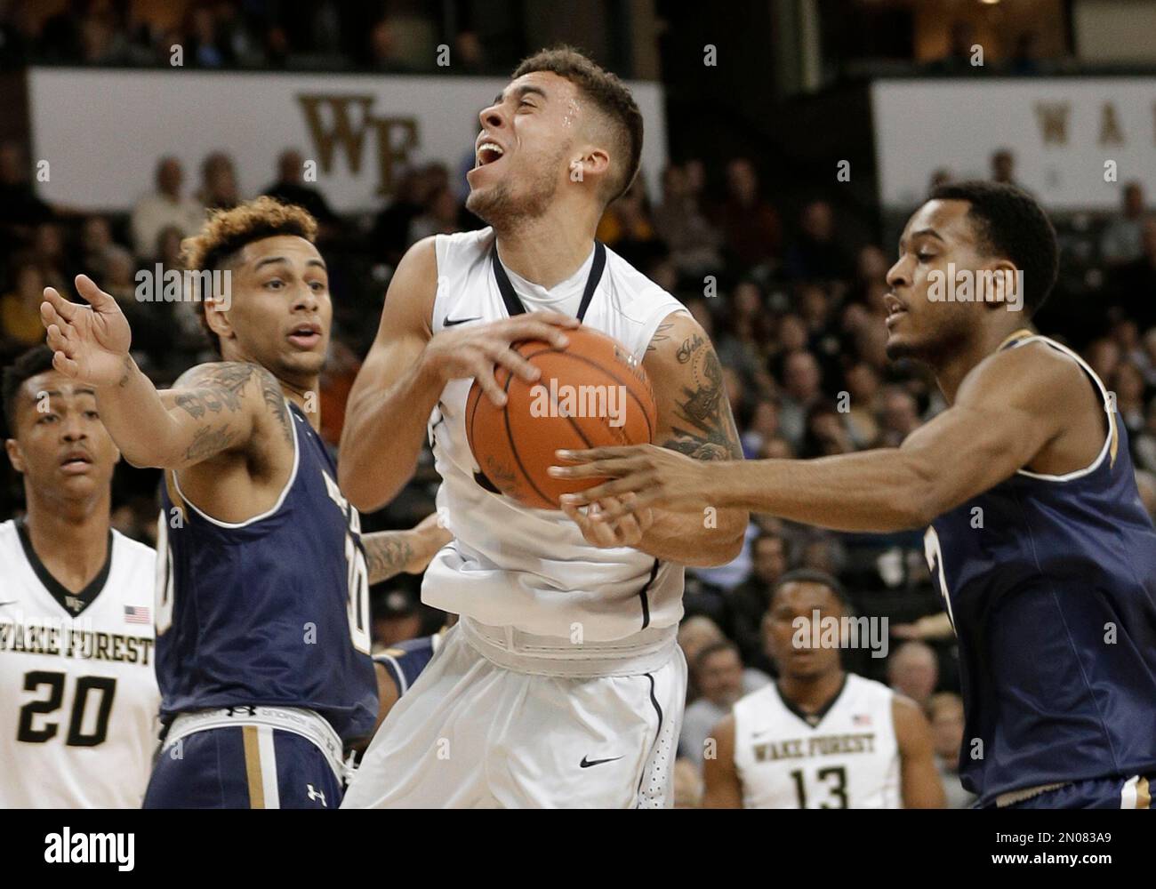 Wake Forest's Mitchell Wilbekin, center, drives between Notre Dame's ...