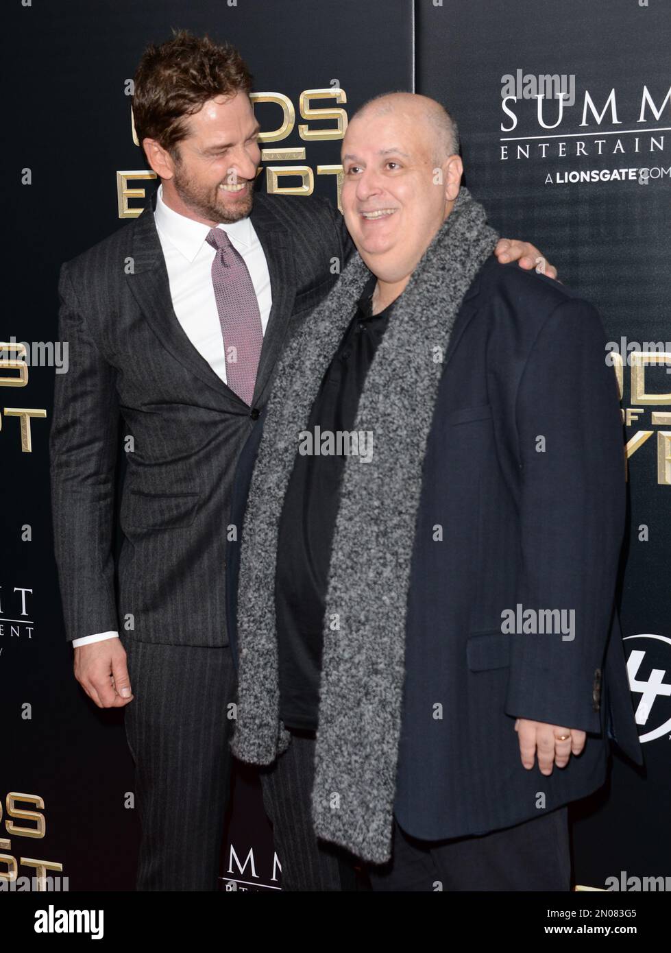 Actor Gerard Butler, left, and director Alex Proyas attend the "Gods of ...