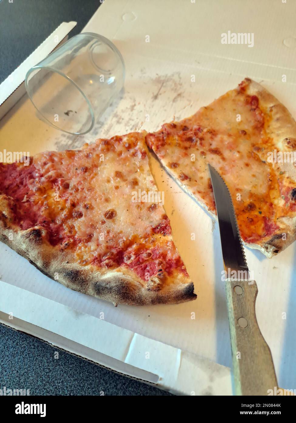 Slice of cheese pizza close-up real life Stock Photo - Alamy