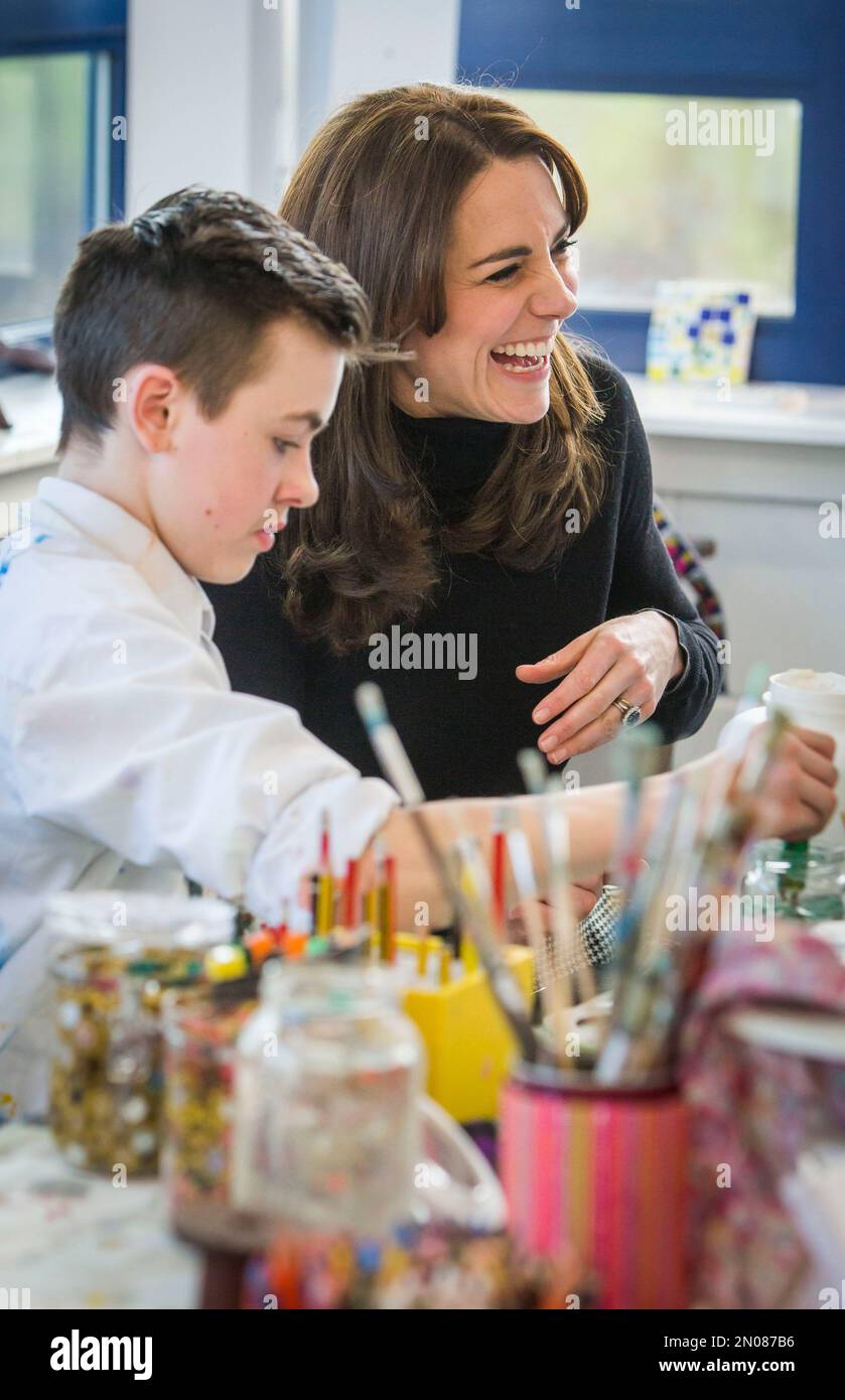 Britain's Kate, the Duchess of Cambridge, right, joins an art class at ...