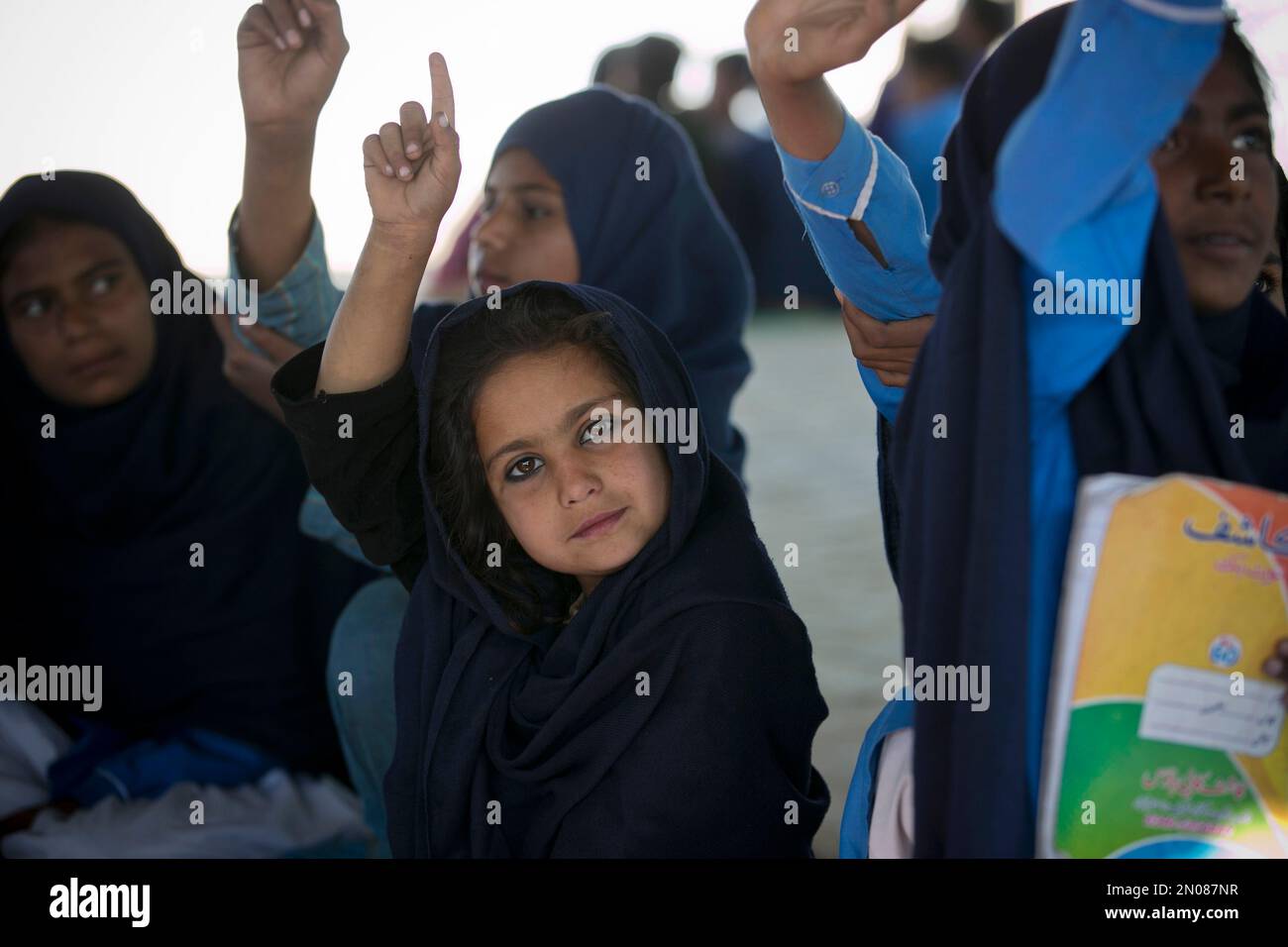 Pakistani students from poor families attend a makeshift school set up ...