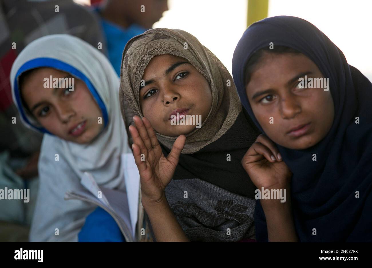 Pakistani students from poor families attend a makeshift school set up ...