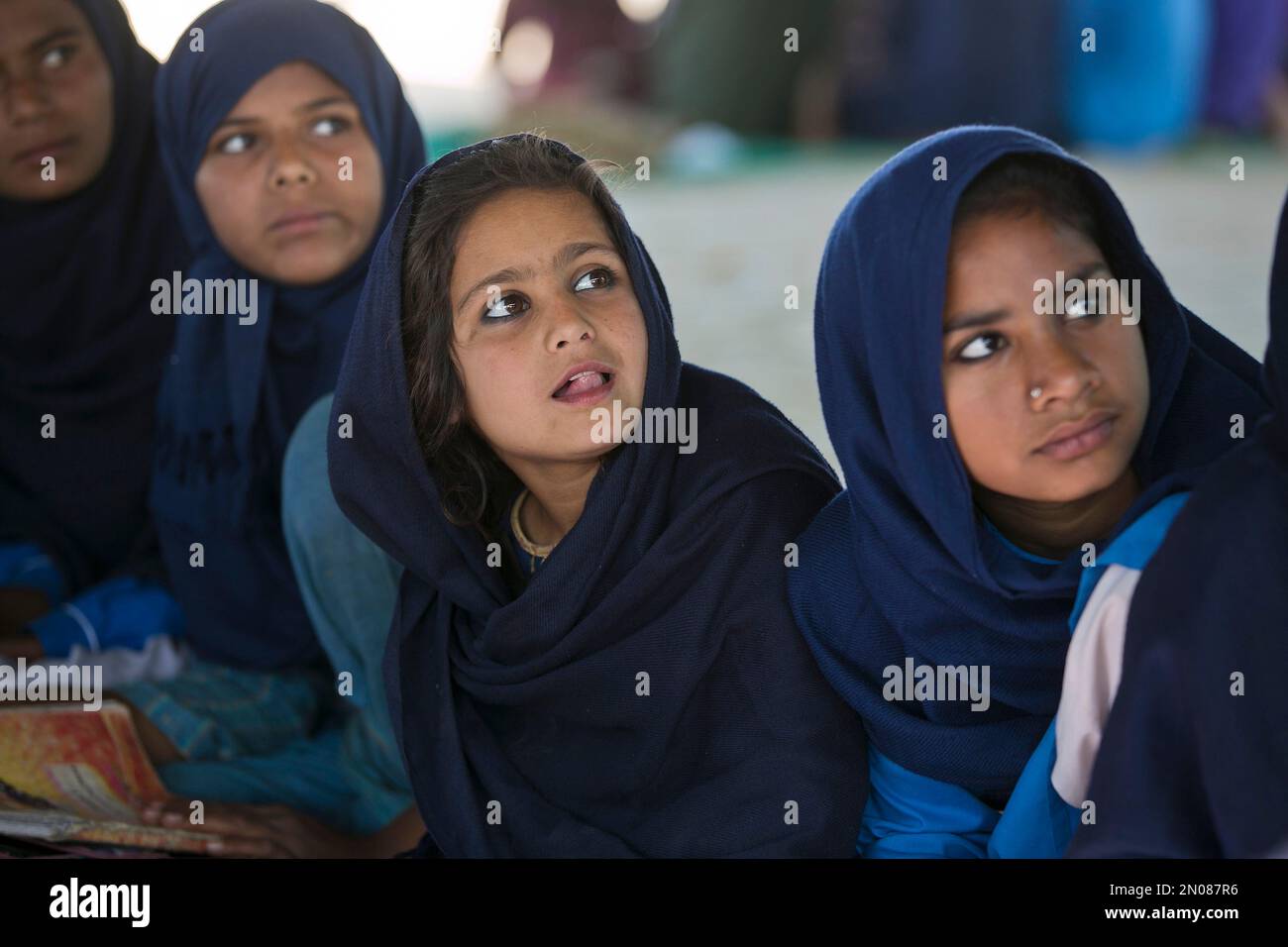 Pakistani students from poor families attend a makeshift school set up ...