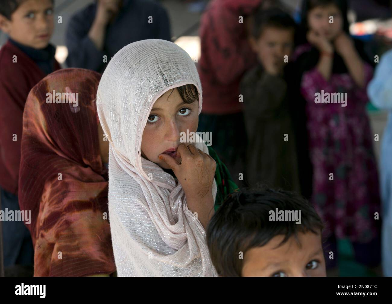 Pakistani students from poor families attend a makeshift school set up ...