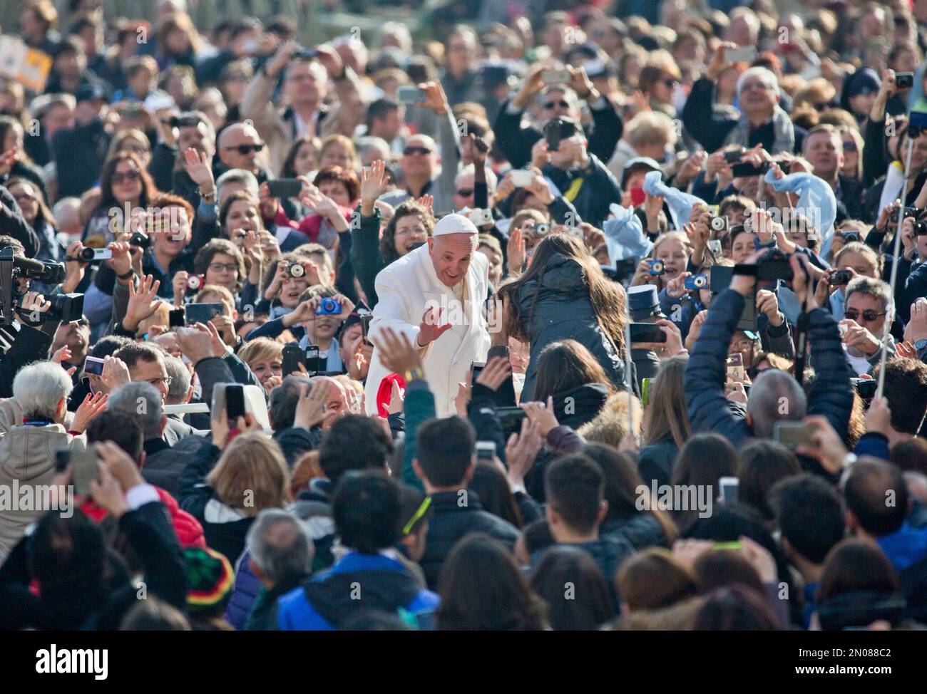 Pope Francis waves to faithful as he arrives on his pope-mobile for his ...