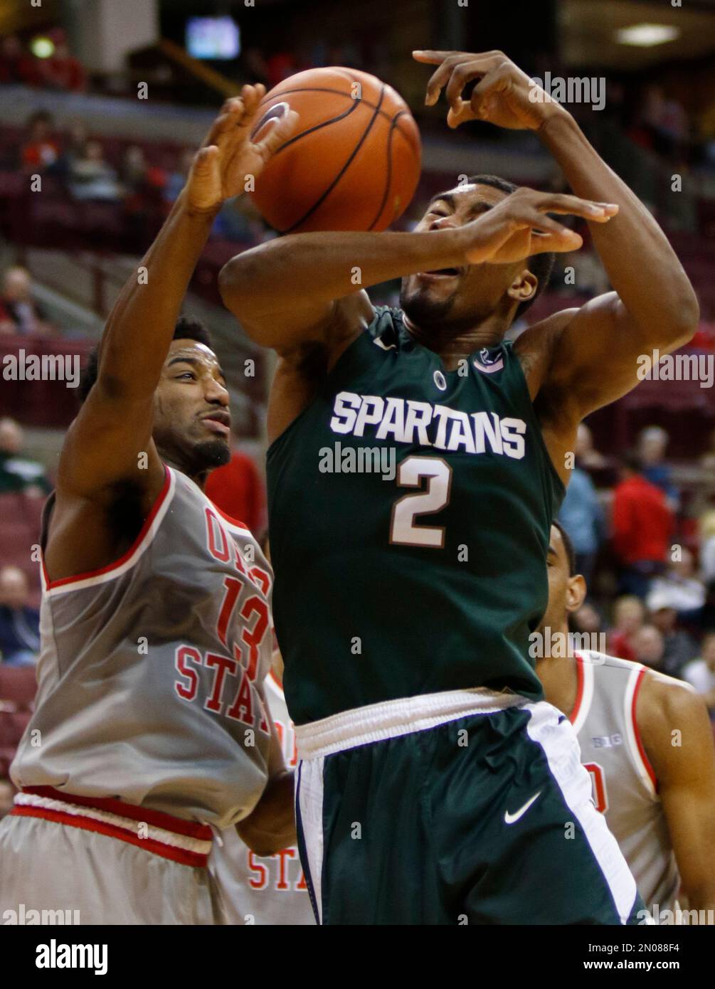 Ohio State's JaQuan Lyle, left, fouls Michigan State's Javon Bess ...