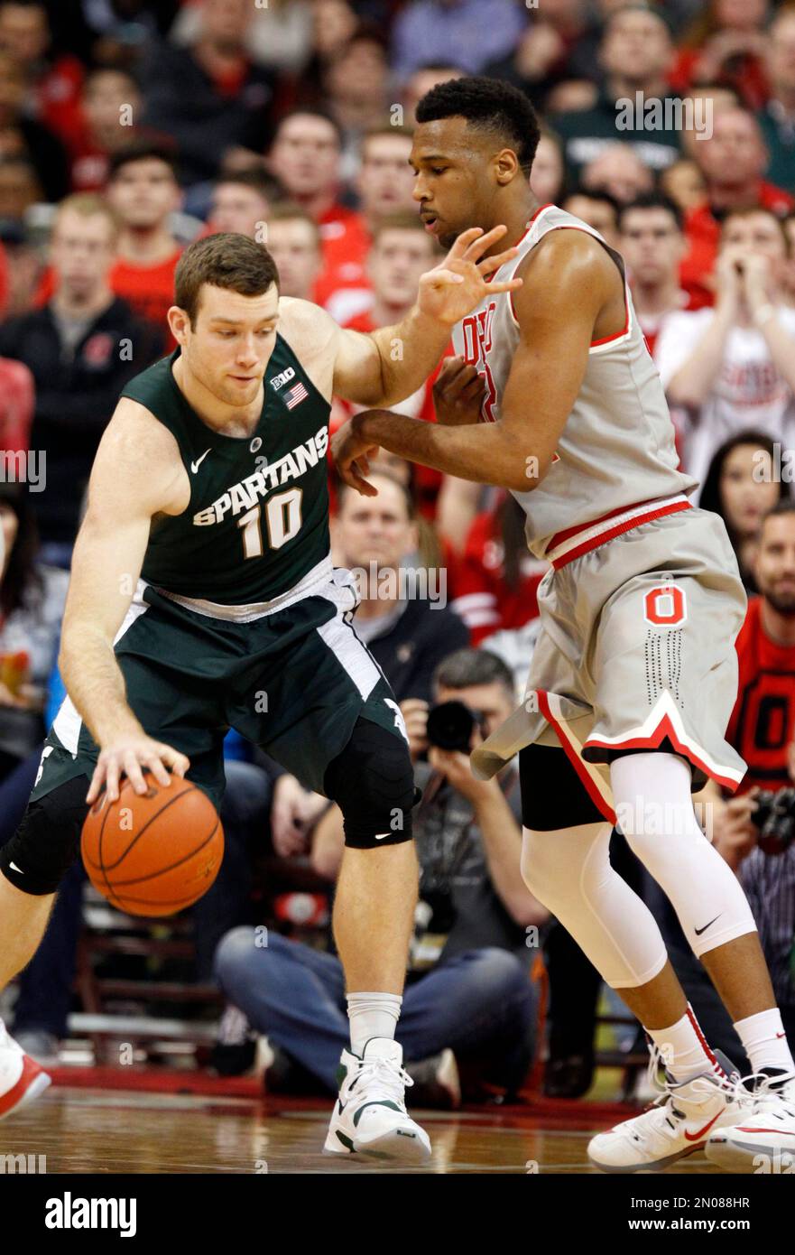 Michigan State's Matt Costello, left, works against Ohio State's Trevor ...